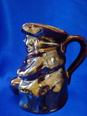 Porcelain & Ceramic - An extremely rare brown / bronze luster Toby jug ...