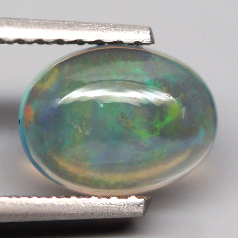 Opal - 0.73Ct. Opal Oval Cabochon Multi Colours Glittering Rainbow 3D! Ethiopian Natural for ...