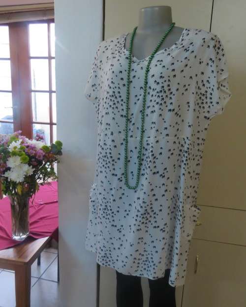 T-shirts & Tops - Playful long white viscose top with tiny black birds ...