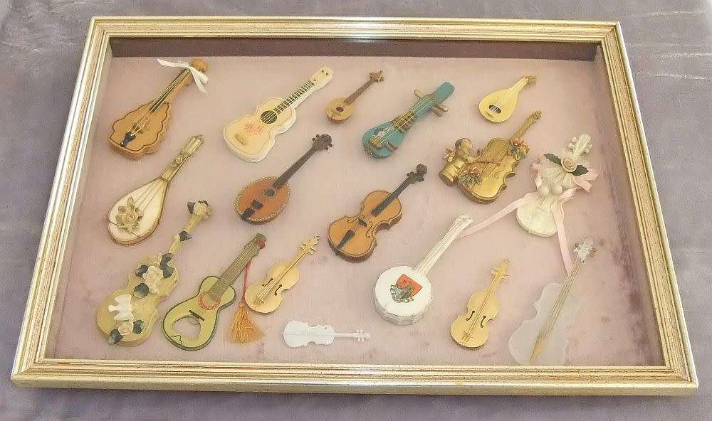 Other Ornaments - A vintage shadow box displaying miniature musical ...