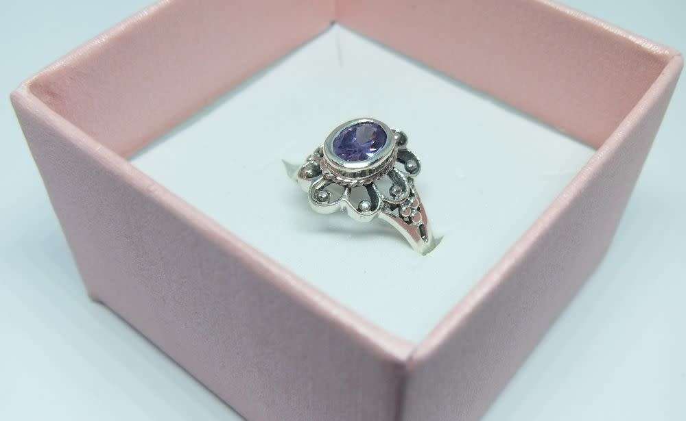 Rings - A genuine sterling silver ring with a faceted purple inset ...
