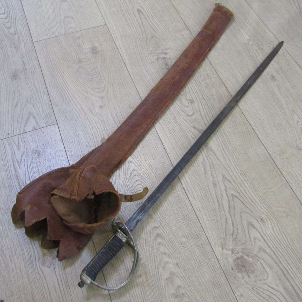 Swords - Royal Artillery sword in leather sleeve who belonged to TEJ St ...
