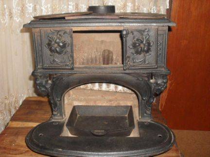 Other Furniture - ANTIQUE CAST IRON COLE STOVE WITH SLIDING DOORS was ...