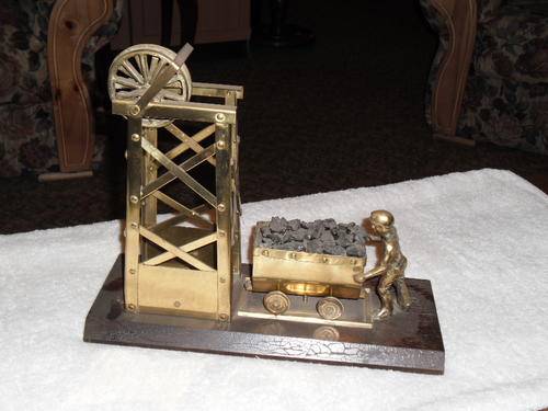 Metal - Brass model Trophy of gold mine headgear was sold for R800.00 ...